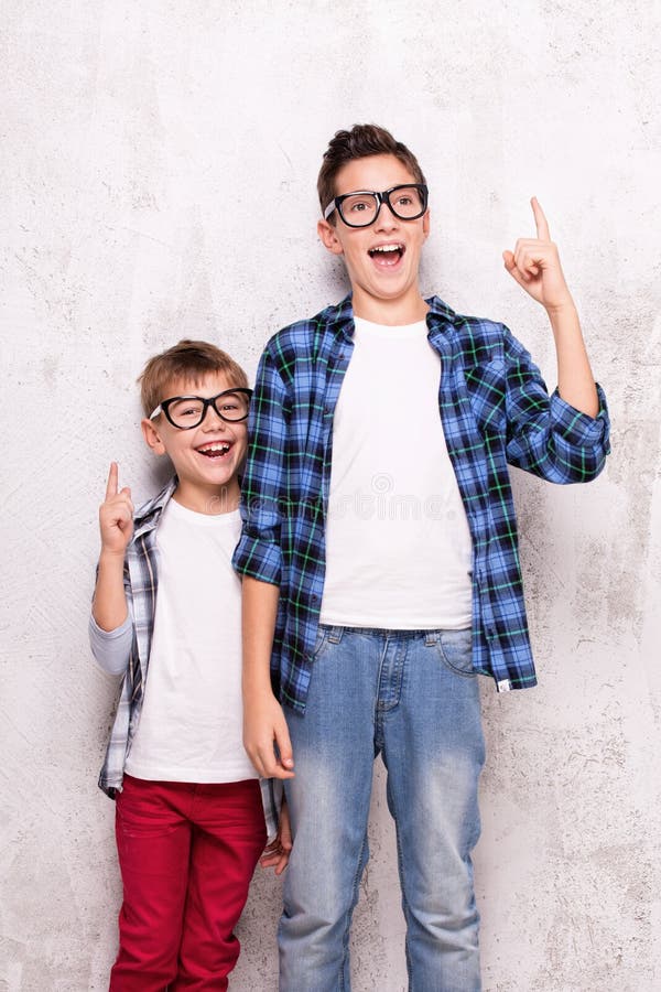Two young brothers posing. stock photo. Image of infant - 80169264