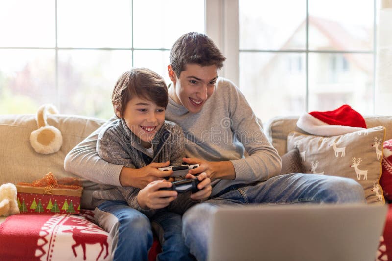 Two Brothers Playing Computer Games at Christmas Time Stock Photo ...