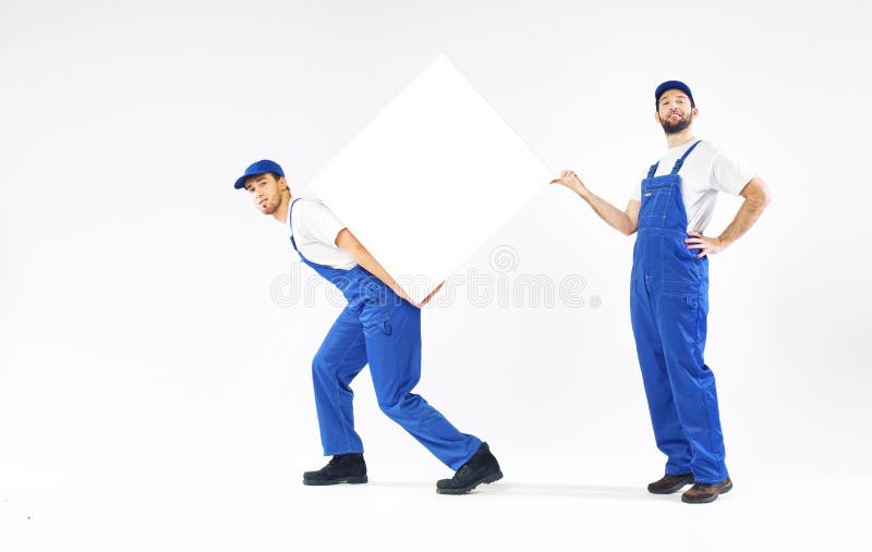 Two Young Builders Holding a Board Stock Photo - Image of house ...