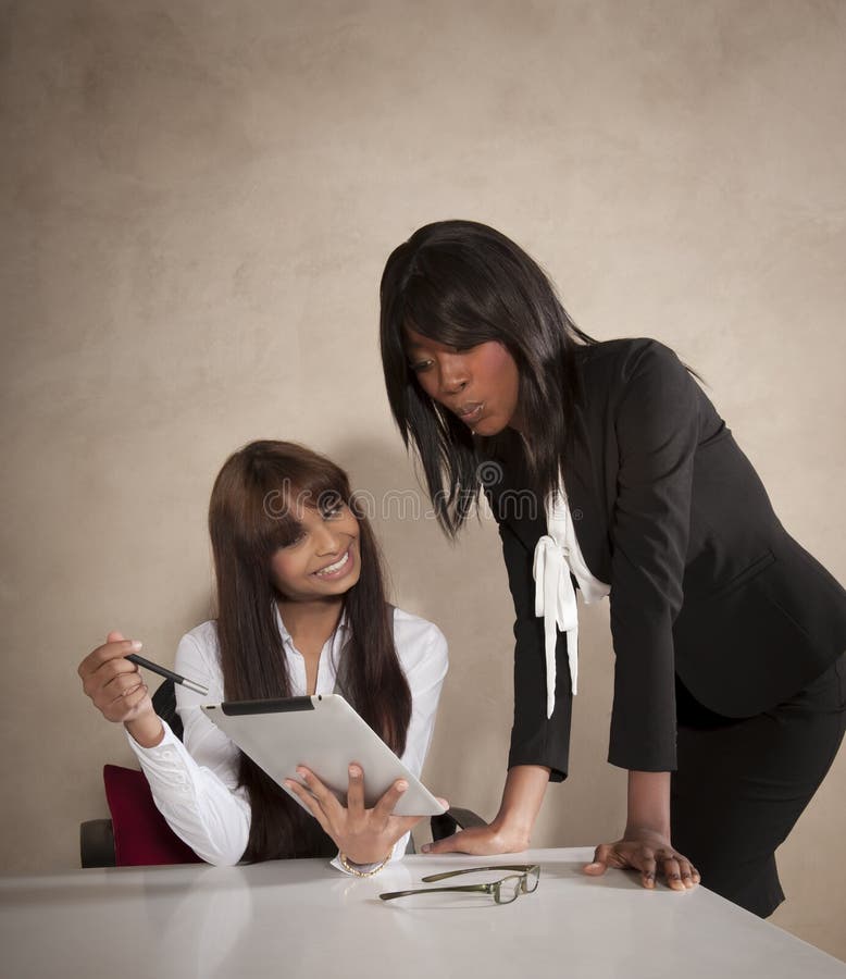 Two Young Business Executives Working at Desk Stock Photo - Image of ...