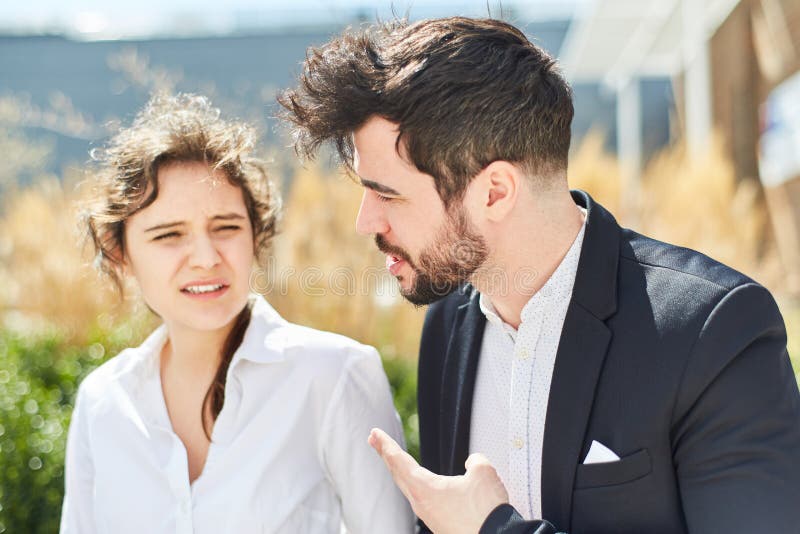 Two Young Business People As a Team in Dialogue Stock Image - Image of ...