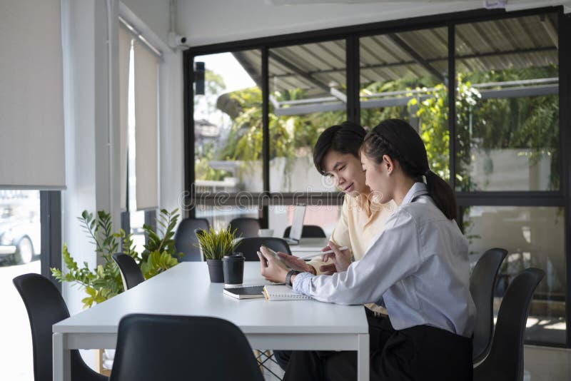 Two Business People Talking Project Strategy at Office. Stock Photo ...