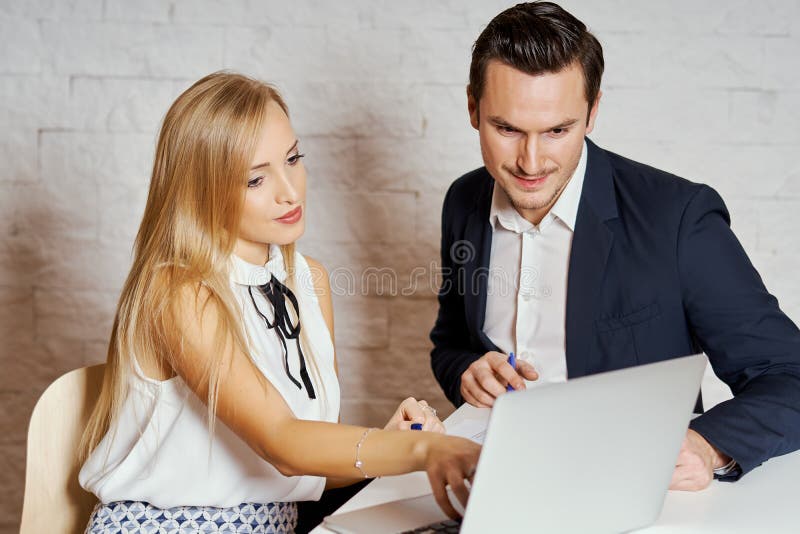 Man and Woman are Looking at the Computer in the Office Stock Image ...