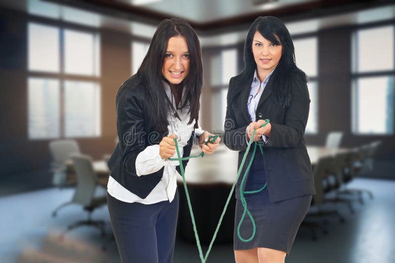 Two Young Business Women Pull the Problems Stock Photo - Image of women ...