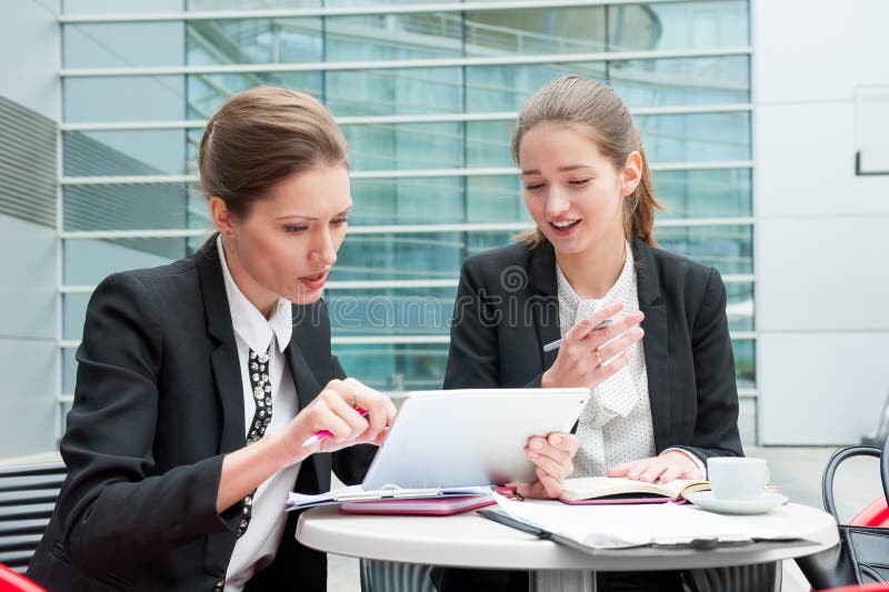 Two young business women stock image. Image of business - 60869247