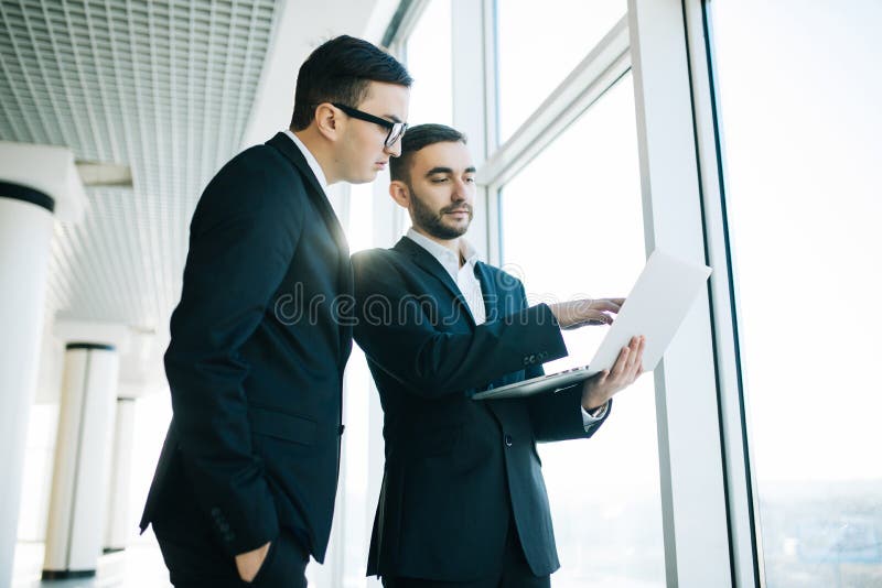 Two Young Businessmen Discussing Project Stock Image - Image of ...