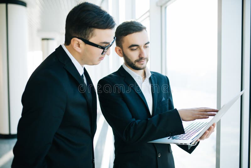 Two Young Businessmen Discussing Project Stock Image - Image of ...
