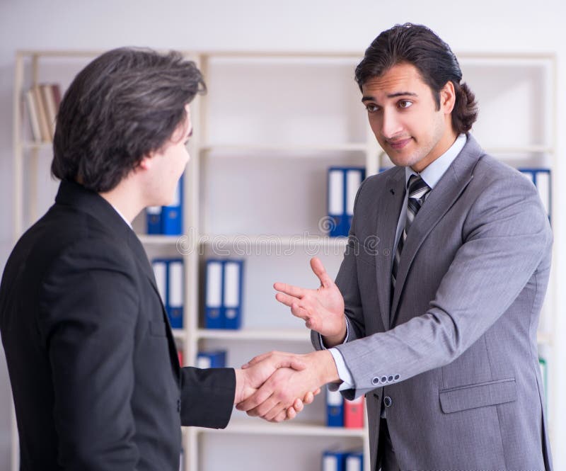 Two Young Businessmen Meeting in the Office Stock Image - Image of ...