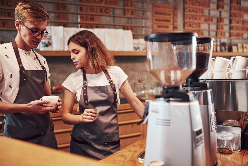 Two Young Cafe Workers Indoors. Conception of Business and Service ...