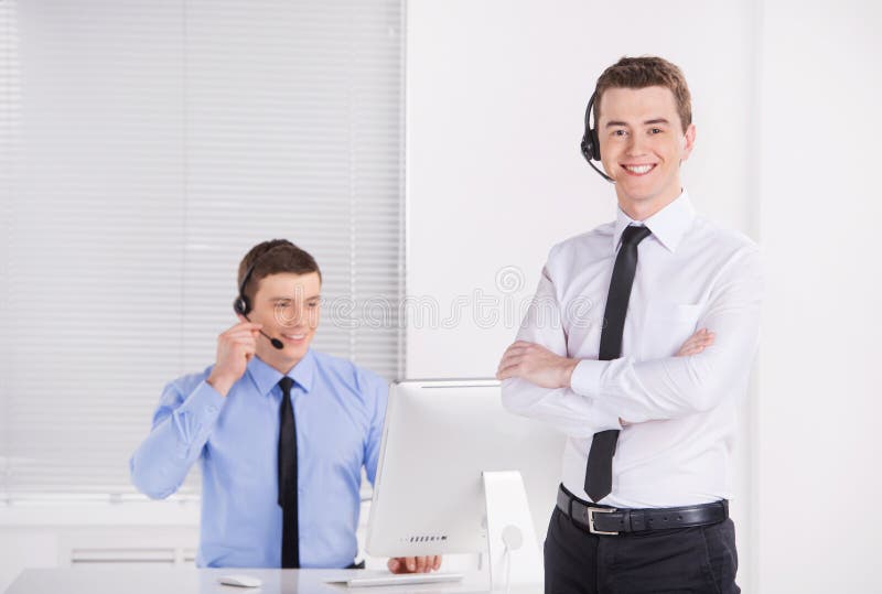 Two Young Call Center Men Talking by Phone. Stock Image - Image of ...
