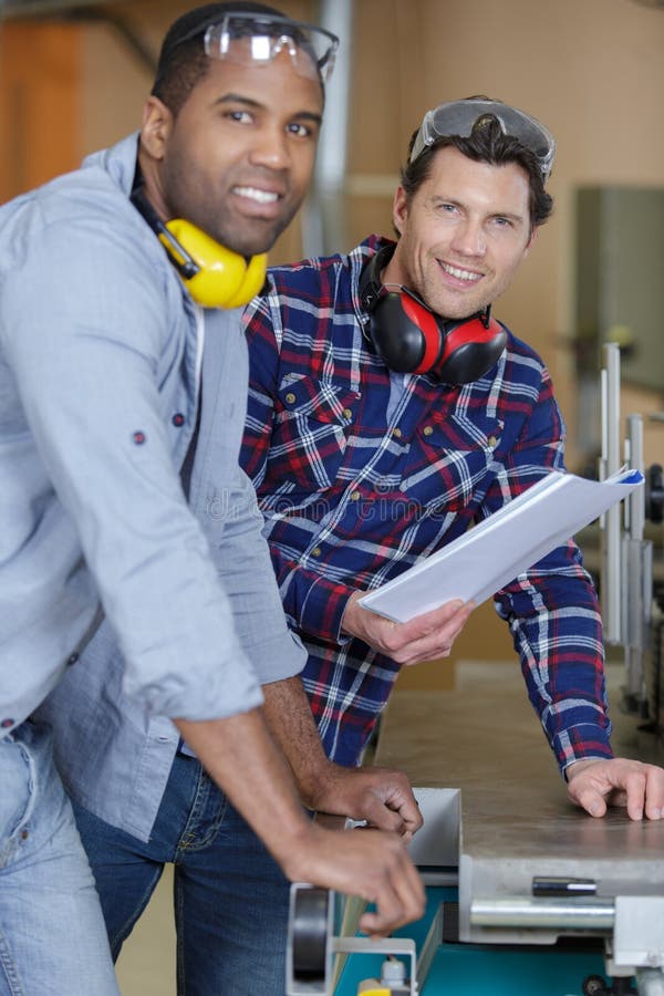 Two Young Carpenters Working in Shop Stock Image - Image of young ...