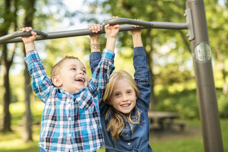 The Two Young Children Having Fun on the Playground Stock Photo - Image ...