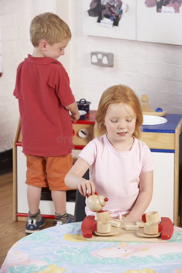 Two Young Children Playing Together at Montessori/ Stock Image - Image ...