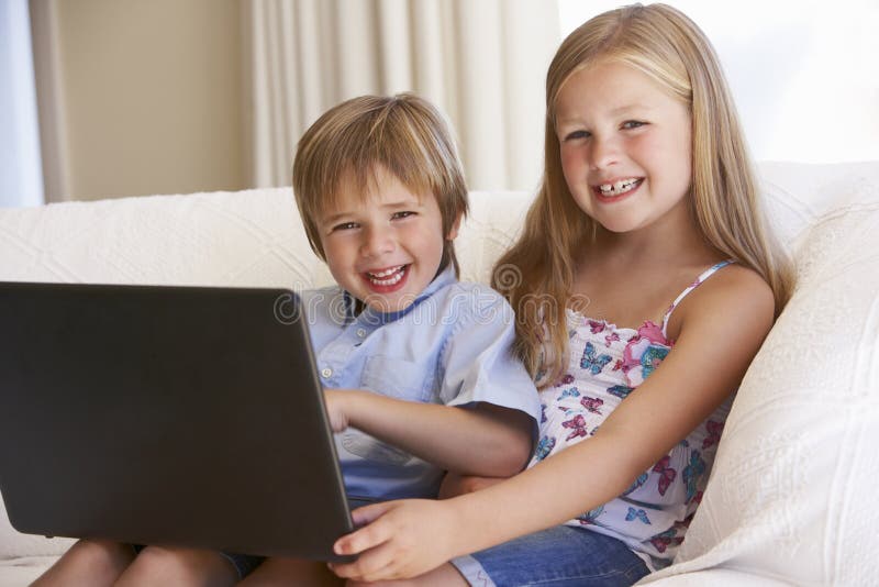 Two Young Children Using Laptop at Home Stock Photo - Image of computer ...