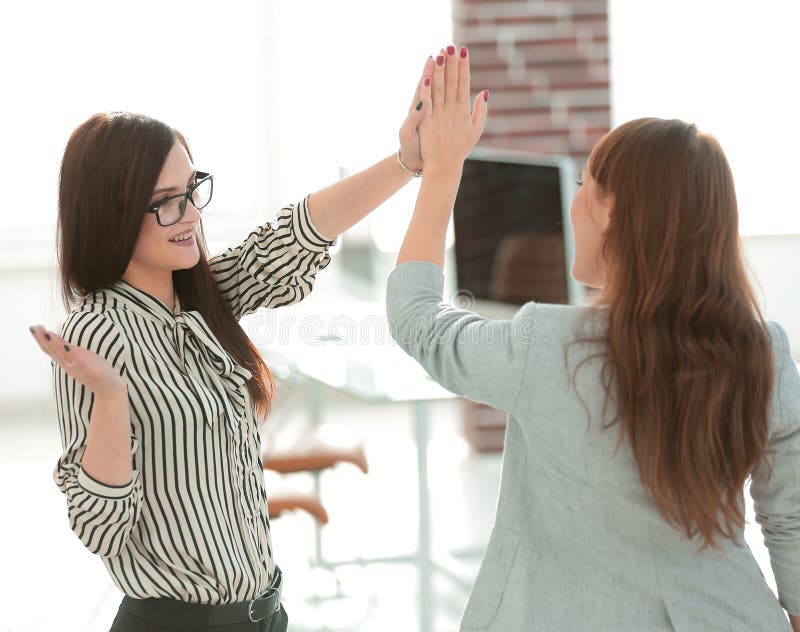 Two Young Co-workers Giving Each Other a High Five Stock Photo - Image ...