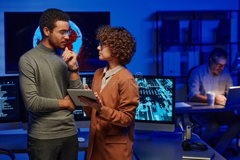 Two Young Confident Programmers Discussing Ideas for New Creative ...