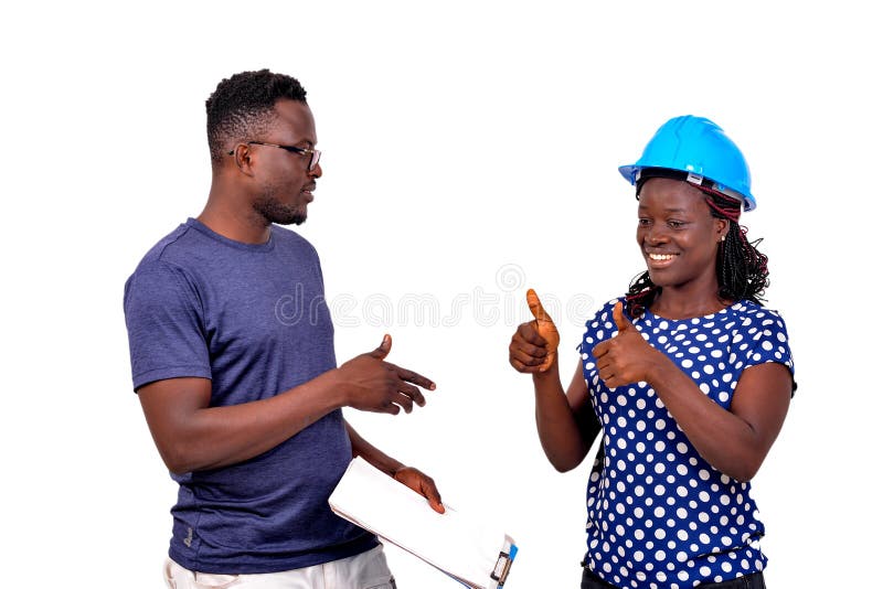 Two Young Construction Engineers Working on a Project Together Stock ...