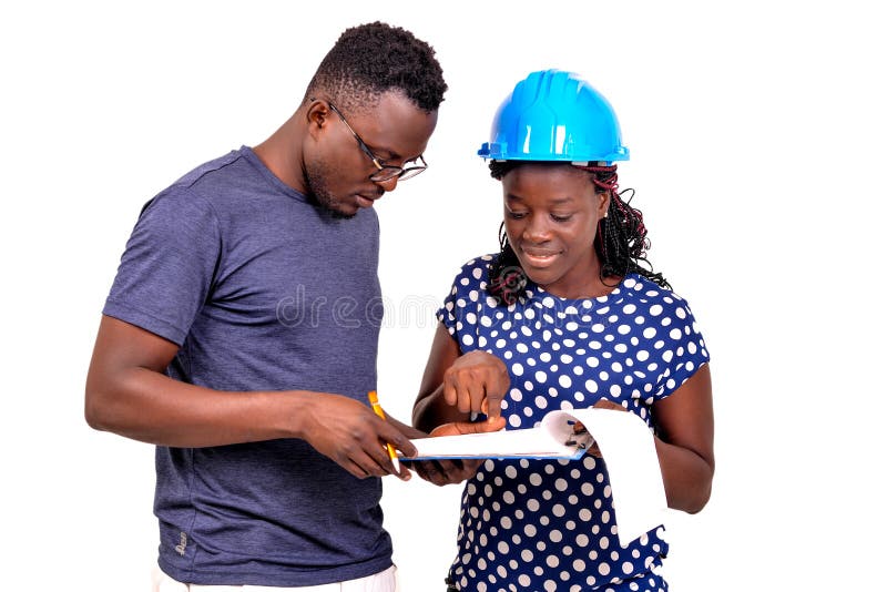 Two Young Construction Engineers Working on a Project Together Stock ...