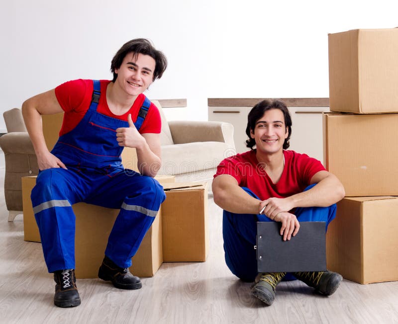 Two Young Contractor Employees Moving Personal Belongings Stock Photo ...