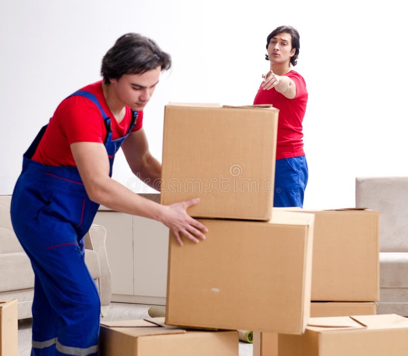 Two Young Contractor Employees Moving Personal Belongings Stock Photo ...