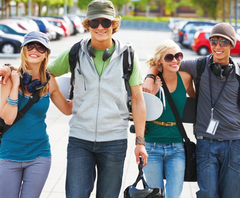 Two young cool couples stock image. Image of female, skateboard - 5614133