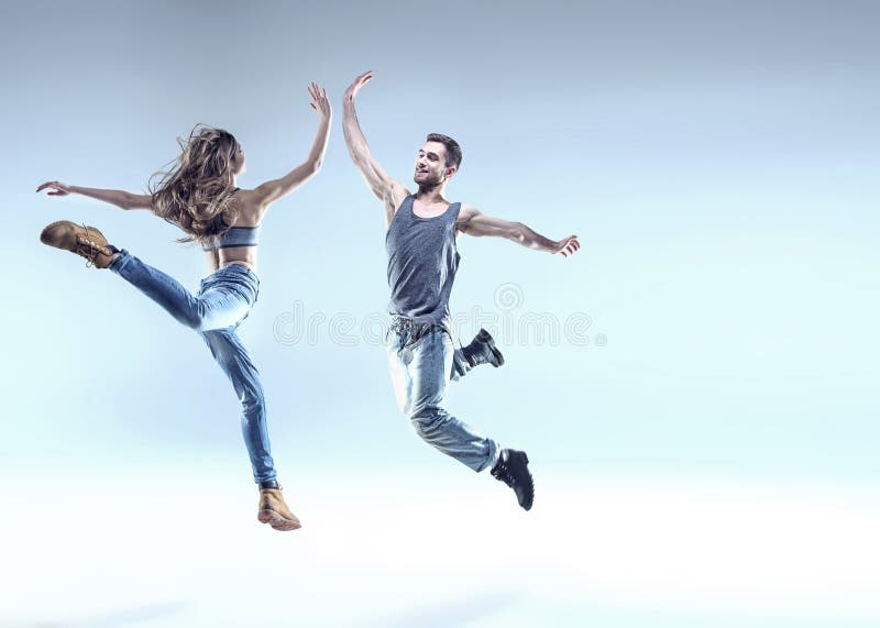 Two Young Dancers in a Jumping Pose Stock Photo - Image of beauty ...