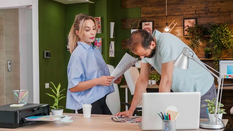 Two Young Designers Debating New Ideas from the Project Stock Photo ...