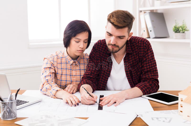 Two Young Designers Working on Project Together. Stock Photo - Image of ...