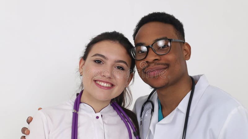 Two Young Doctors Meeting and Talking at Work Computer Stock Video ...