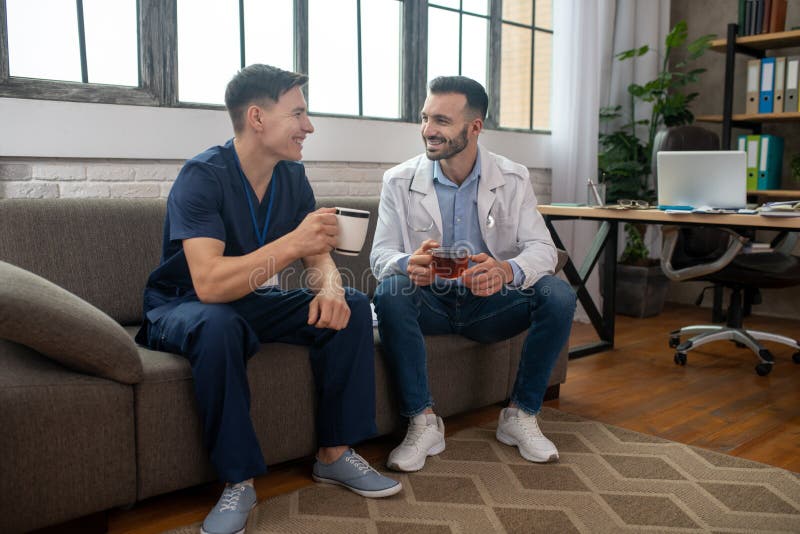Two Young Doctors Having Conversation during Breakfast Stock Image ...