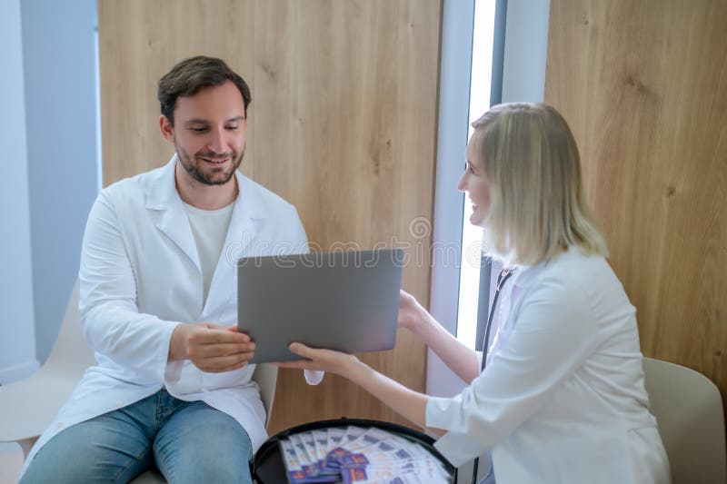 Two Young Doctors at Worki at the Hospital Stock Image - Image of ...