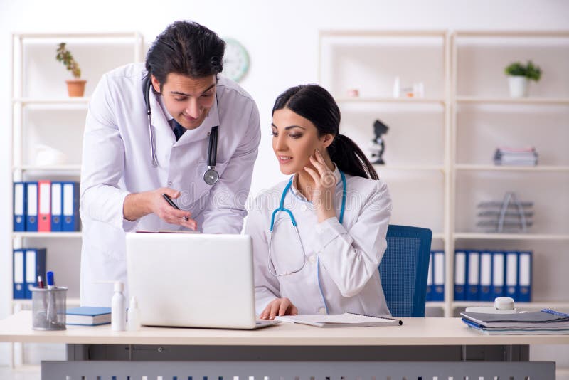 The Two Young Doctors Working in the Clinic Stock Photo - Image of ...