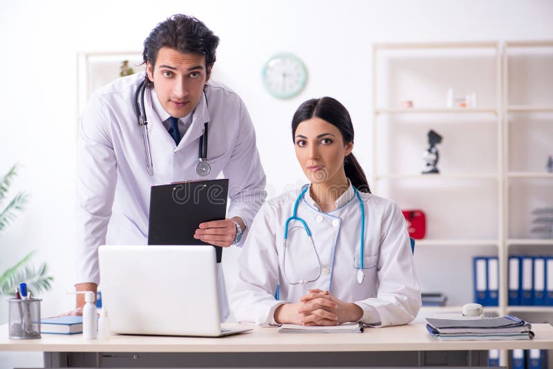 The Two Young Doctors Working in the Clinic Stock Photo - Image of ...