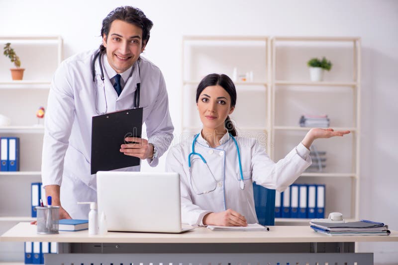 The Two Young Doctors Working in the Clinic Stock Image - Image of ...