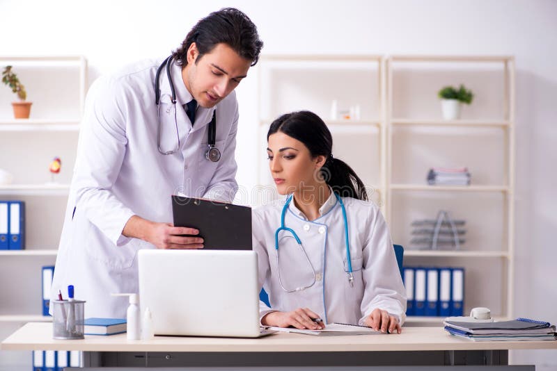 The Two Young Doctors Working in the Clinic Stock Photo - Image of ...