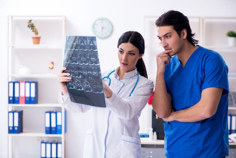 The Two Young Doctors Working in the Clinic Stock Photo - Image of ...