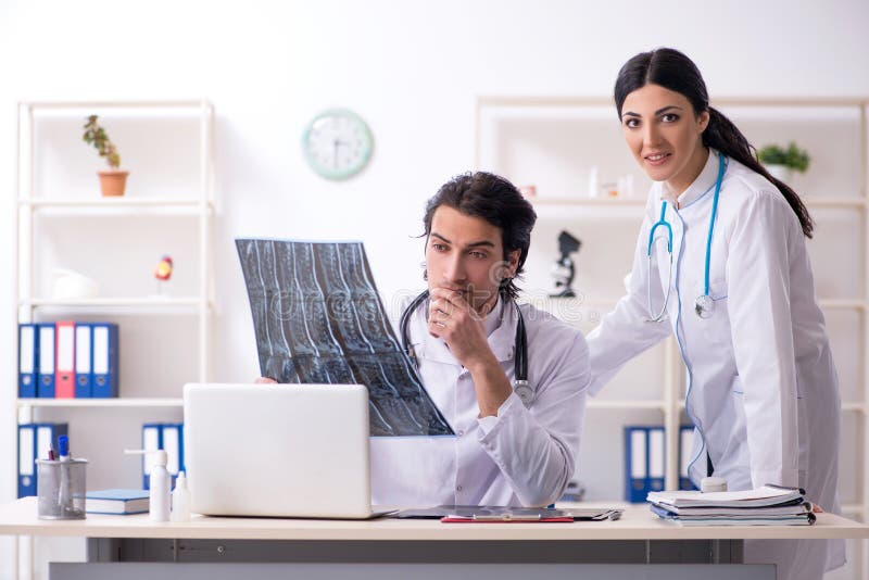 The Two Young Doctors Working in the Clinic Stock Photo - Image of ...