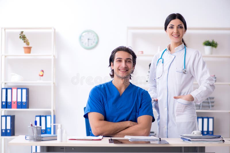 The Two Young Doctors Working in the Clinic Stock Image - Image of ...