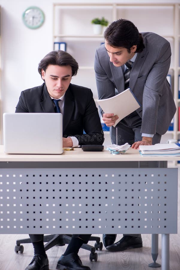 Two Young Employees Working in the Office Stock Photo - Image of intern ...