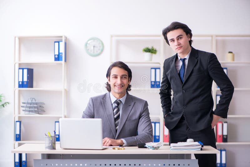 Two Young Employees Working in the Office Stock Image - Image of ...