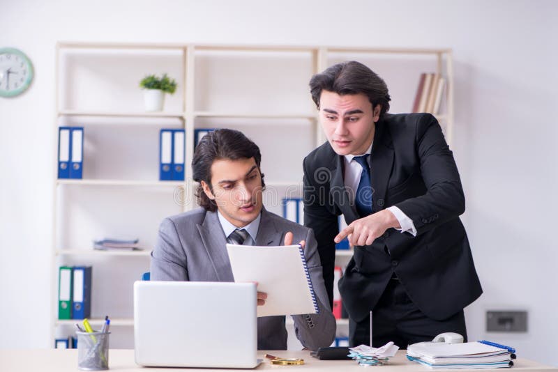 Two Young Employees Working in the Office Stock Photo - Image of ...