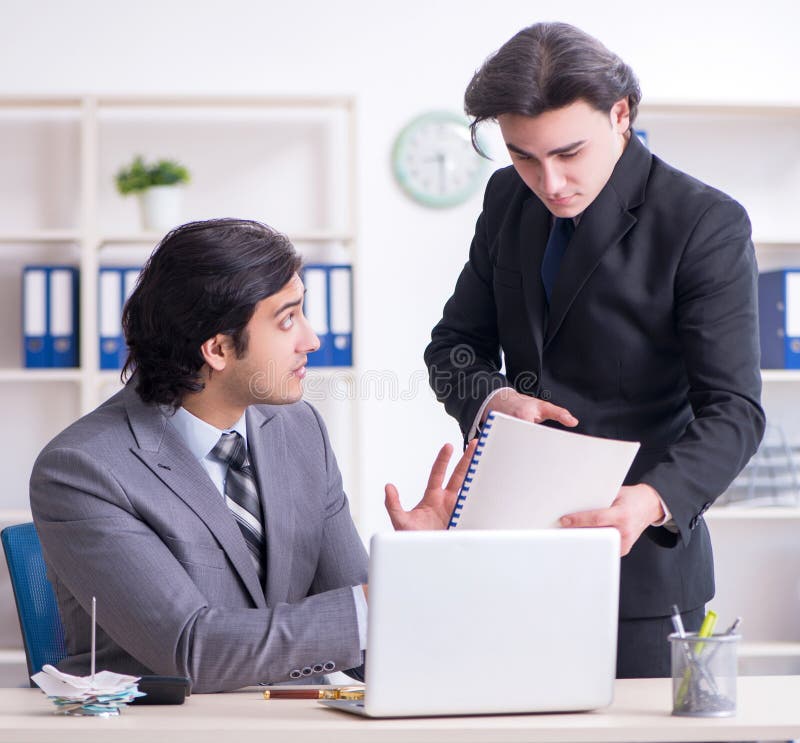 Two Young Employees Working in the Office Stock Image - Image of ...