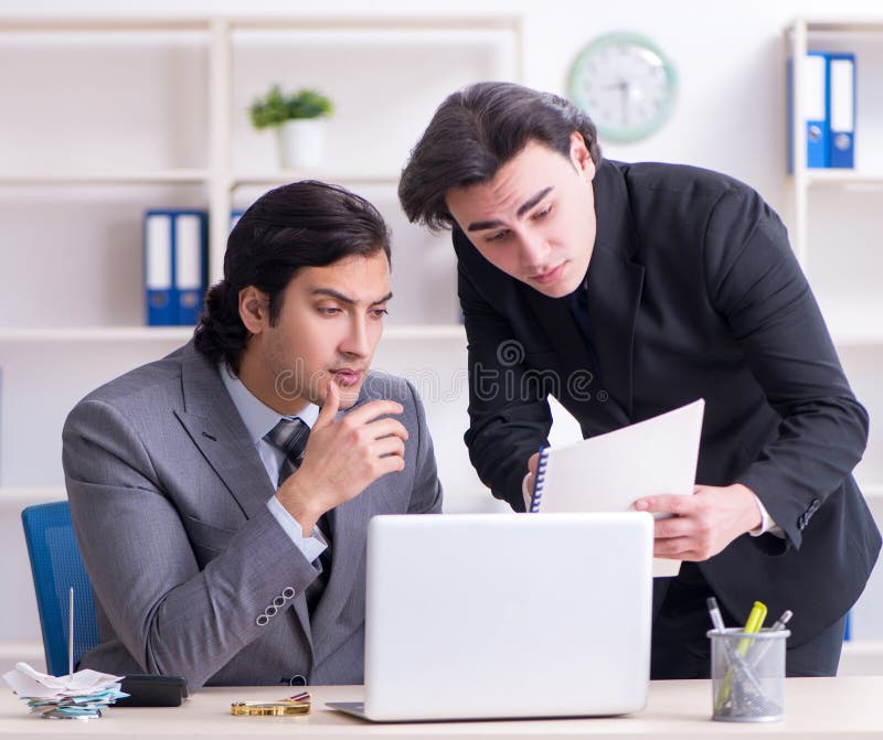 Two Young Employees Working in the Office Stock Photo - Image of ...