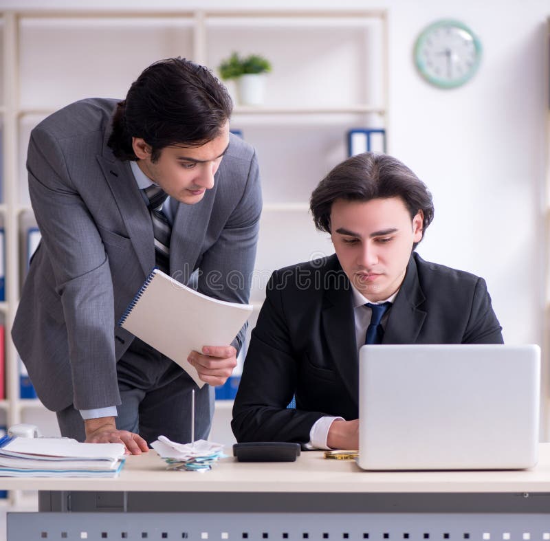 Two Young Employees Working in the Office Stock Photo - Image of ...