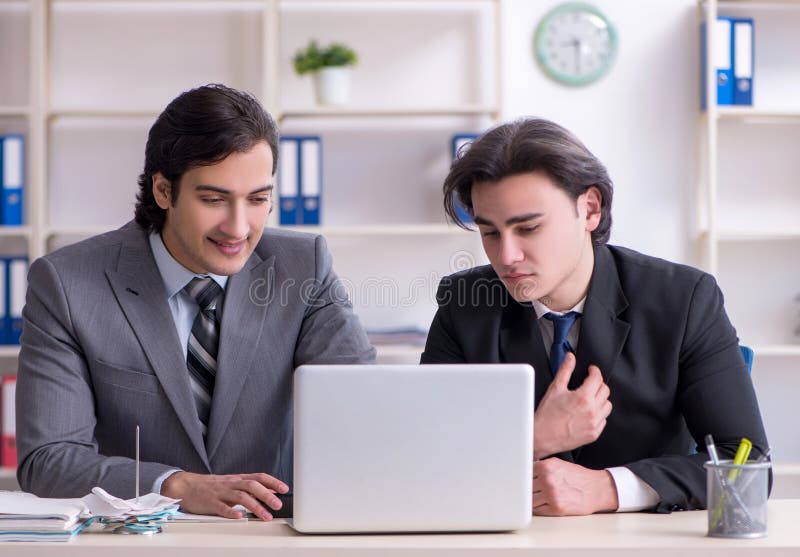 Two Young Employees Working in the Office Stock Photo - Image of office ...