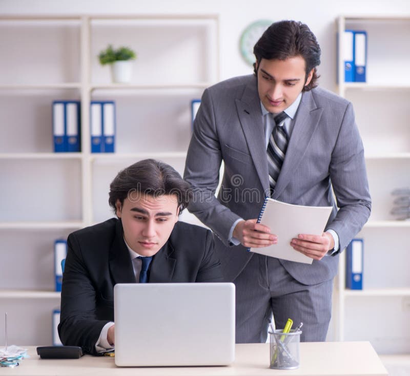 Two Young Employees Working in the Office Stock Photo - Image of laptop ...