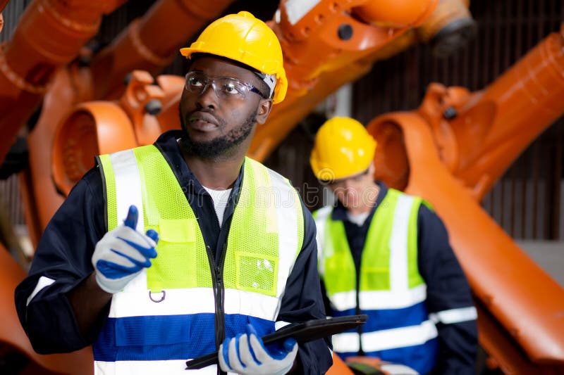 Two Young Engineer Man Checking and Maintenance Machine Robot Arms ...
