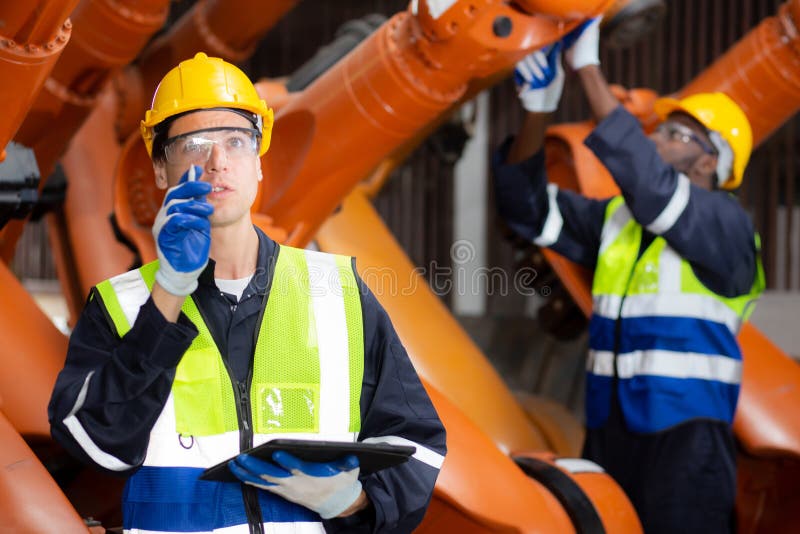 Two Young Engineer Man Checking and Maintenance Machine Robot Arms ...