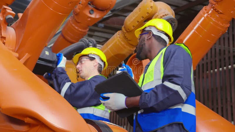 Two Young Engineer Man Meeting and Explaining about Robot Arms ...