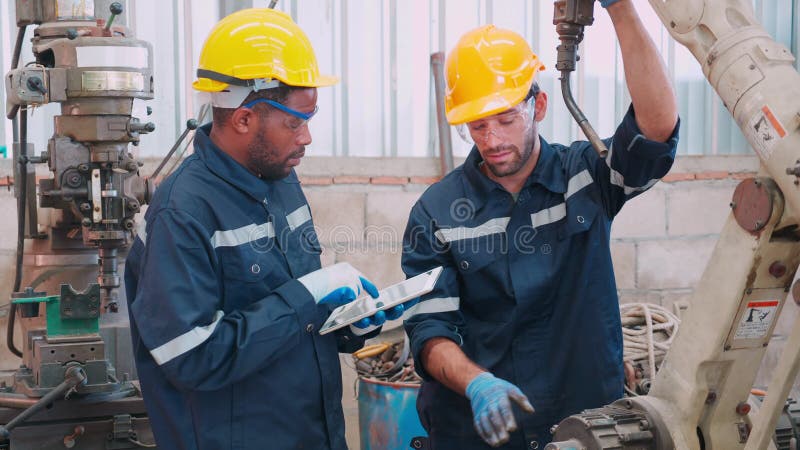 Two Young Engineer Man Talking and Explaining about Robot Arms ...